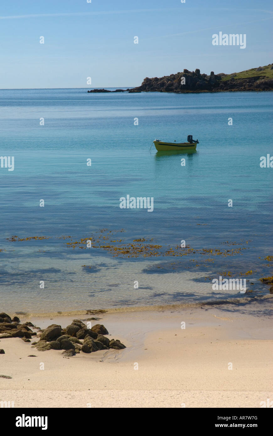 Dinghy moored off Gugh island and St Agnes in the Scilly Isles England ...