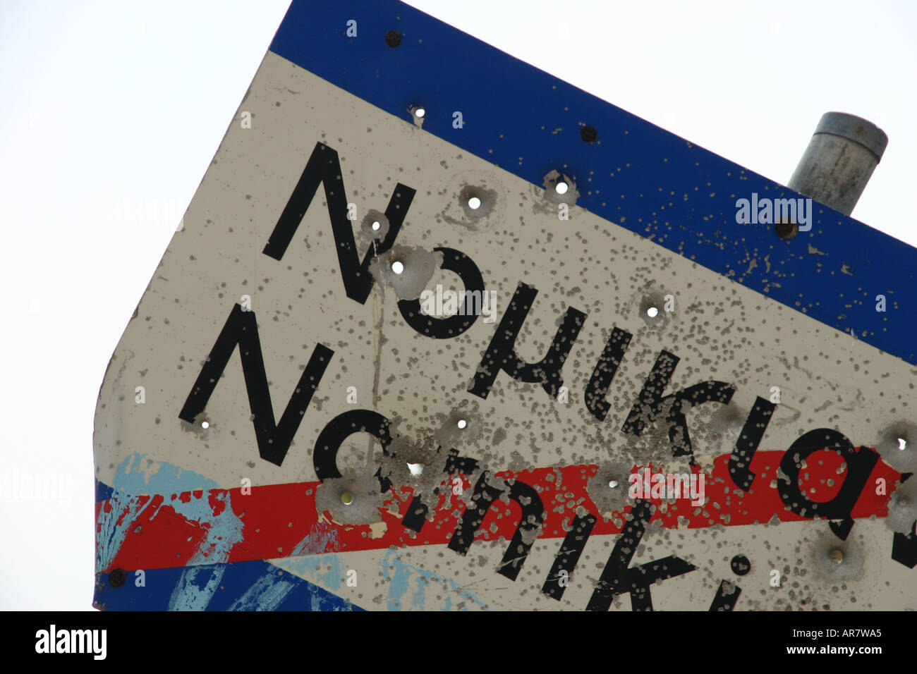 Bullet holes in road sign Crete Stock Photo - Alamy