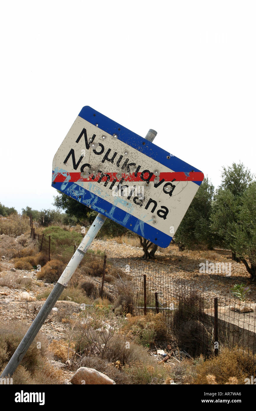 Bullet holes in road sign Crete Stock Photo - Alamy