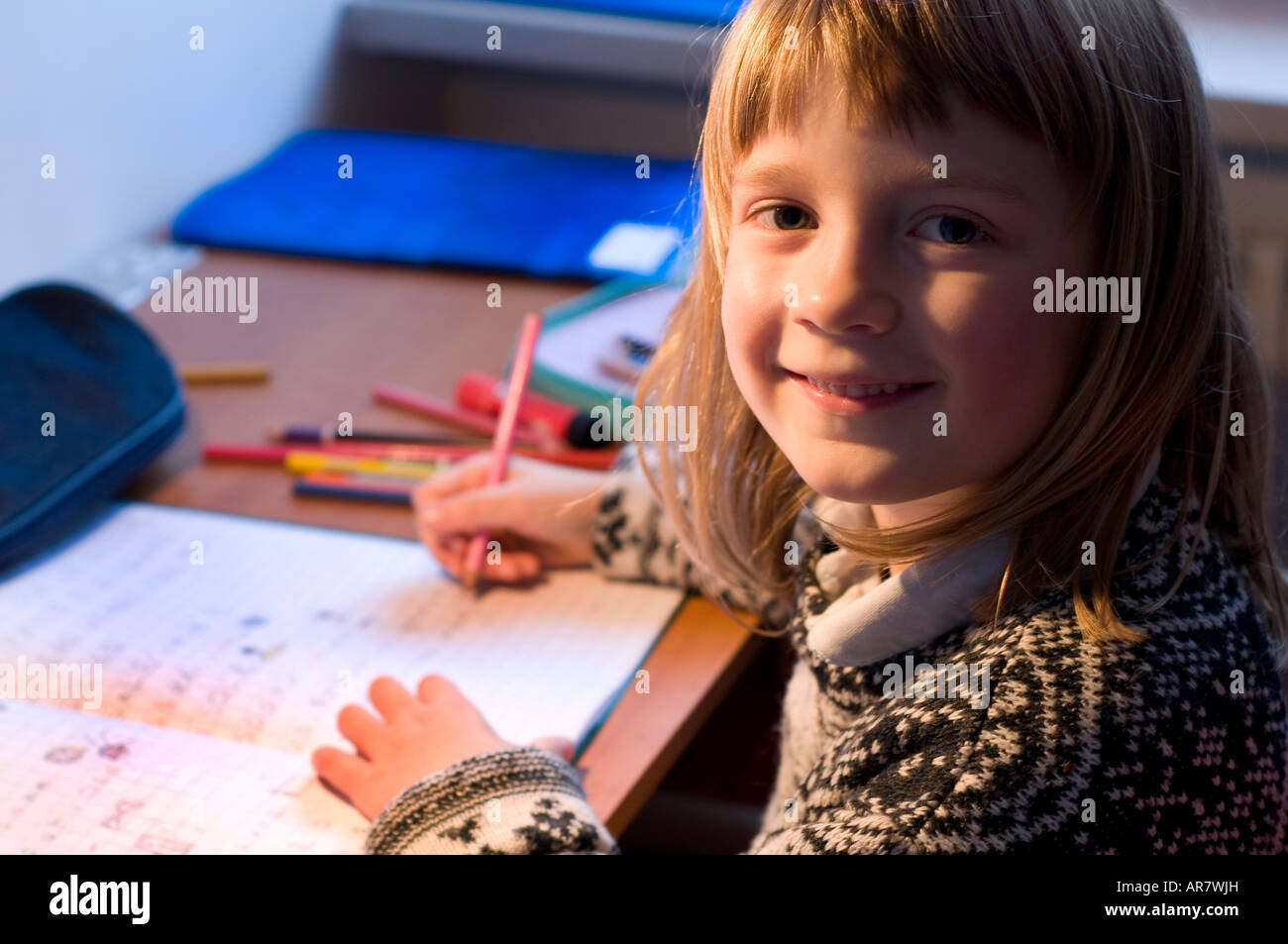 a little girl doing her homework at home Stock Photo - Alamy