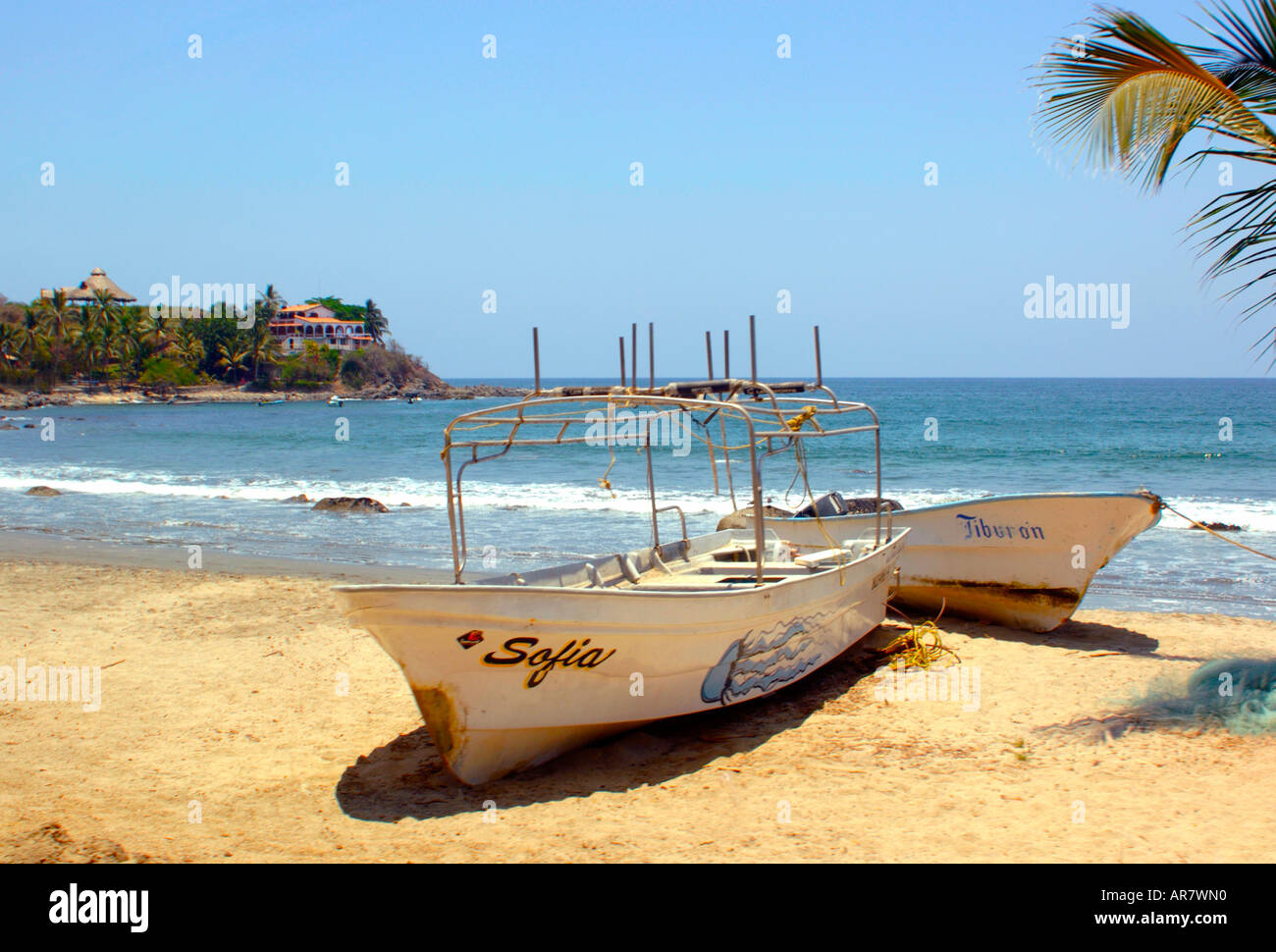 Boats on a Tropical Beach Stock Photo - Alamy