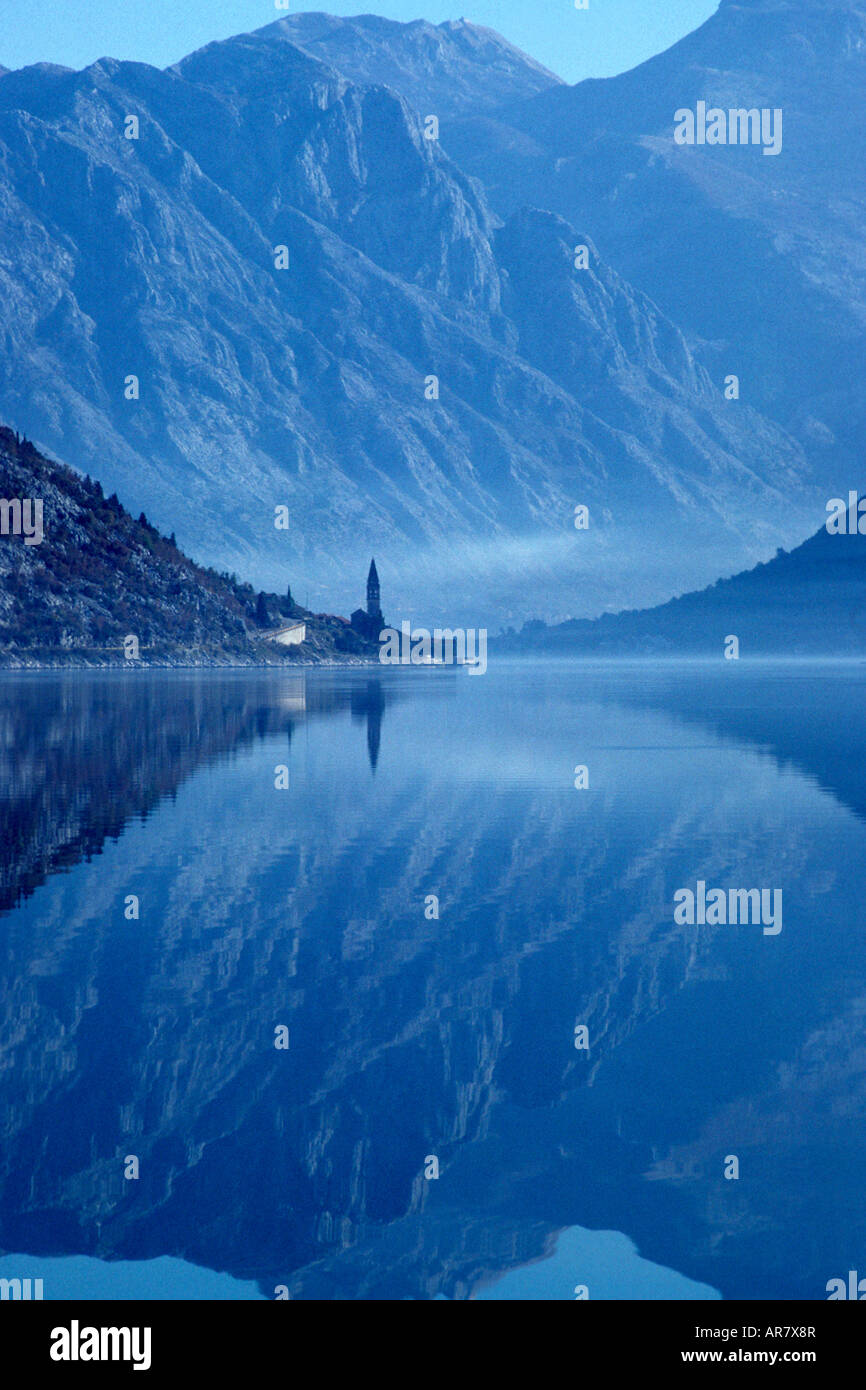 A majestic view of mountain and lake with symmetrical reflection near ...