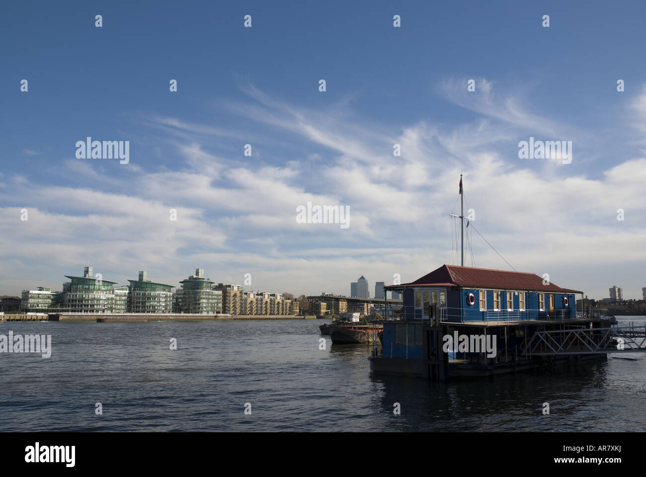 The Harpy pontoon and Canary Wharf beyond from St Saviours Dock London ...