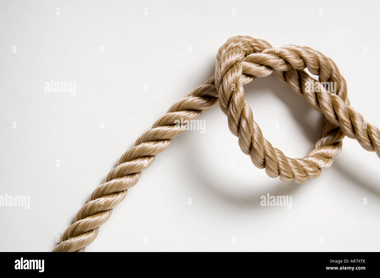 Loosely tied knot in rope Stock Photo - Alamy