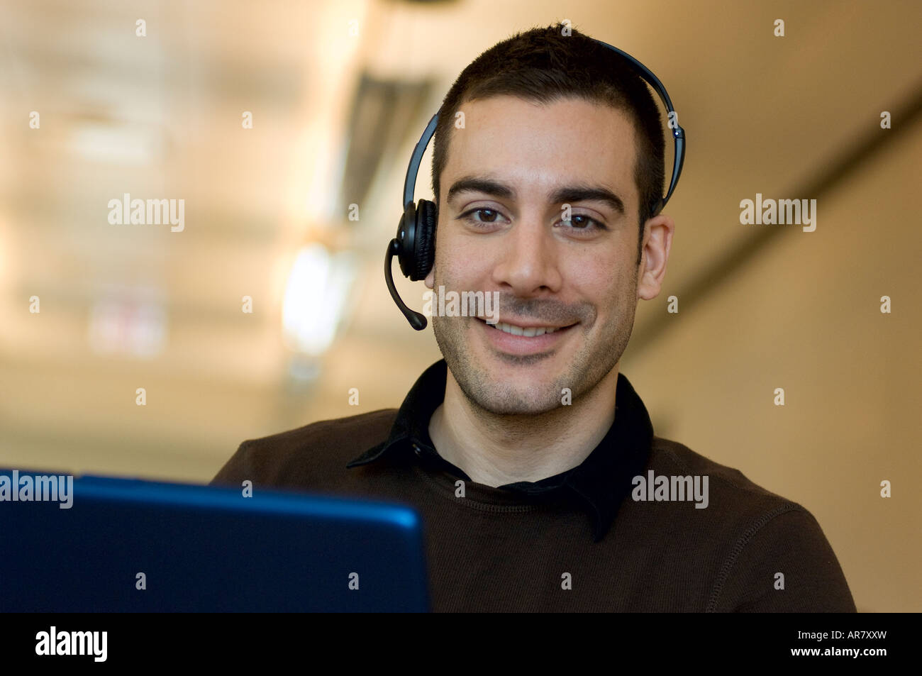 Friendly male call center employee Stock Photo - Alamy