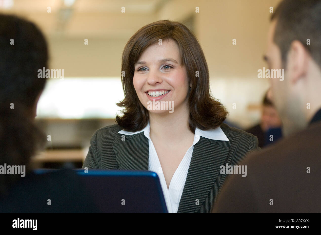 Sales consultant presenting to clients Stock Photo - Alamy