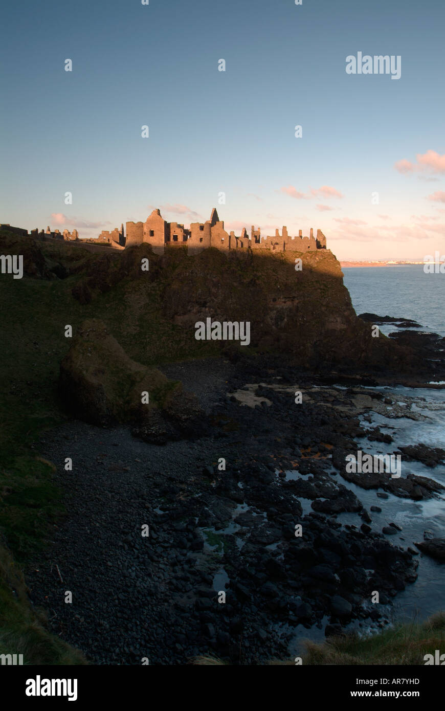 Clear skies at sunrise over Dunseverick Castle along the causeway coast ...