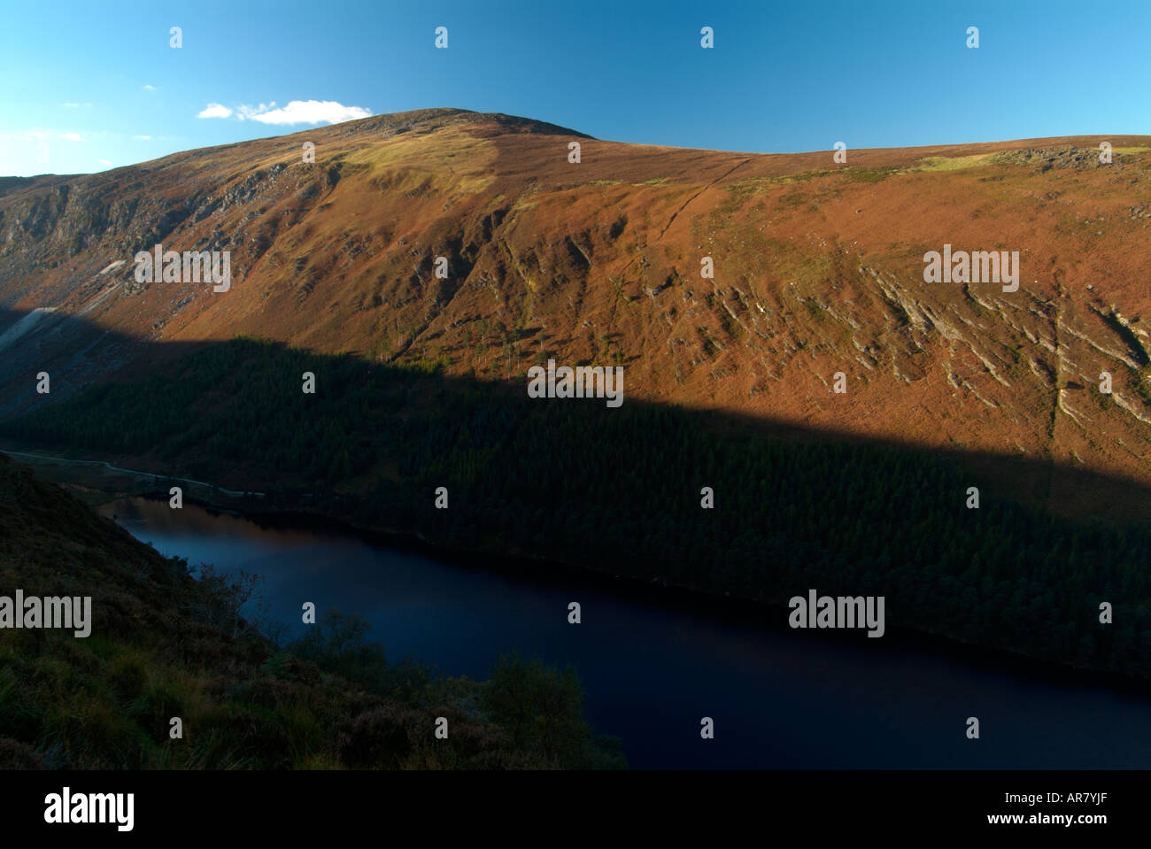 Clear blue sky over the upperlake at Glendalough, County Wicklow ...