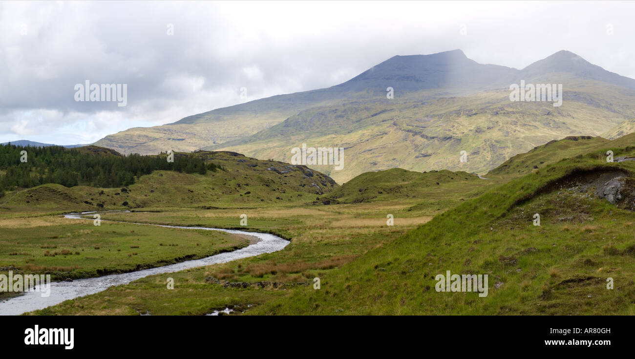 A stream flowing down from a distant mountain Stock Photo - Alamy