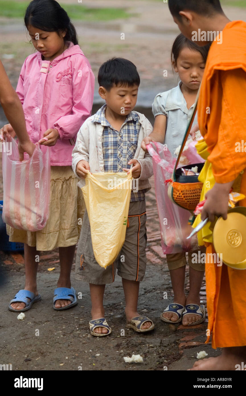 Alms giving custom laos hi-res stock photography and images - Alamy