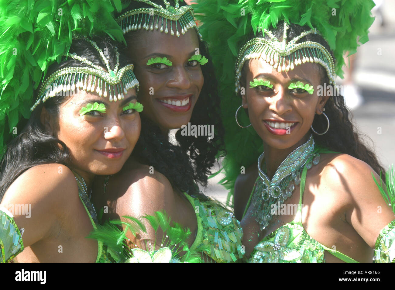 Three women, carnival street scene, Trinidad Stock Photo - Alamy