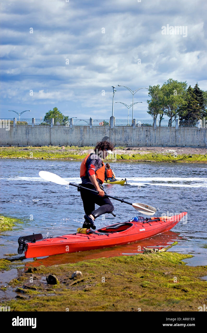 Sea kayaker getting ready for a trip on Rimouski river Stock Photo - Alamy