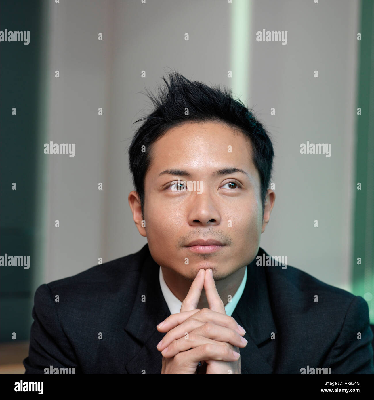 Portrait of businessman thinking Stock Photo - Alamy