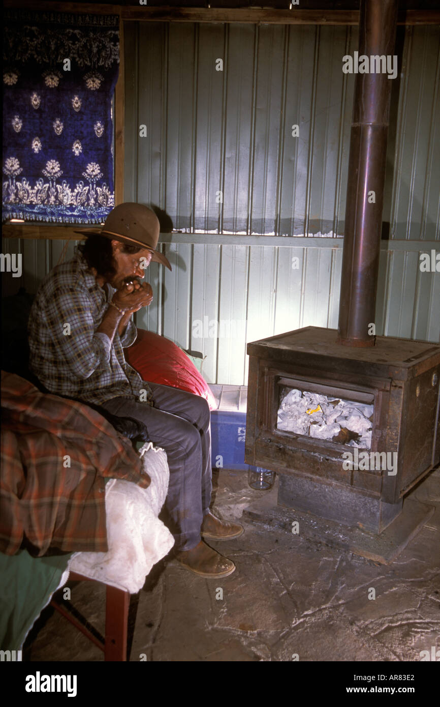 Aboriginal Man playing mouth organ Iga Warta community in Northern ...