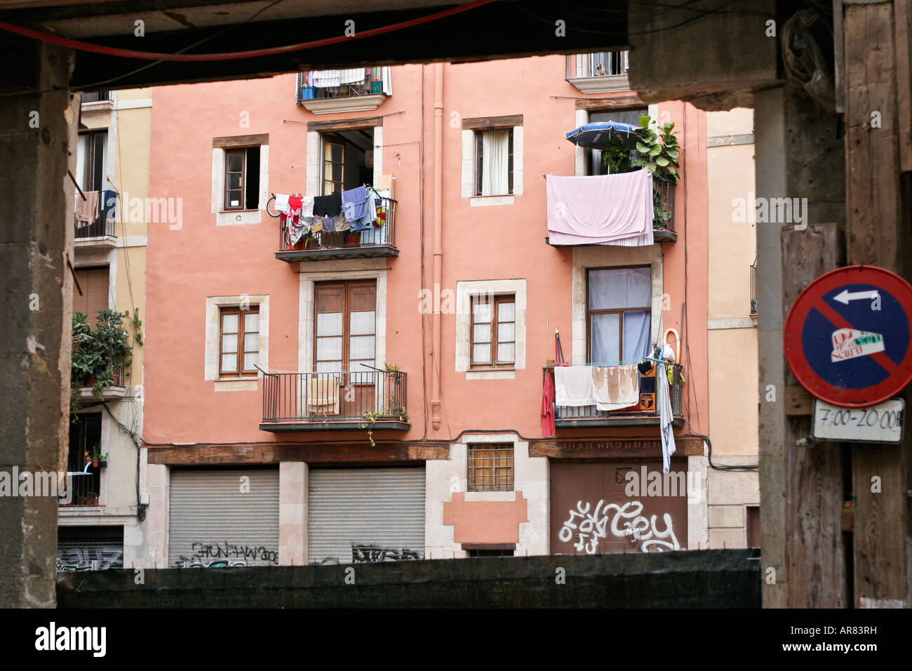 A typical stucco tenement block framed in the silhouette of an entrance ...