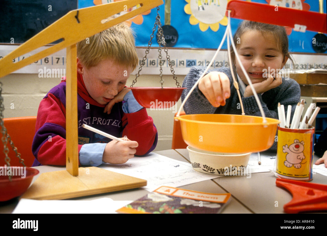 primary school children experimenting with weights and measures Stock ...