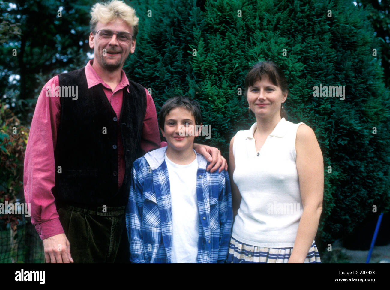 Family with single child portrait Stock Photo - Alamy