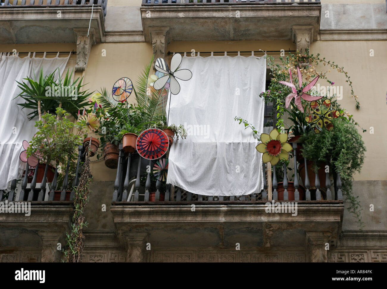 Typical spanish balcony in a narrow street in Barcelona Stock Photo - Alamy
