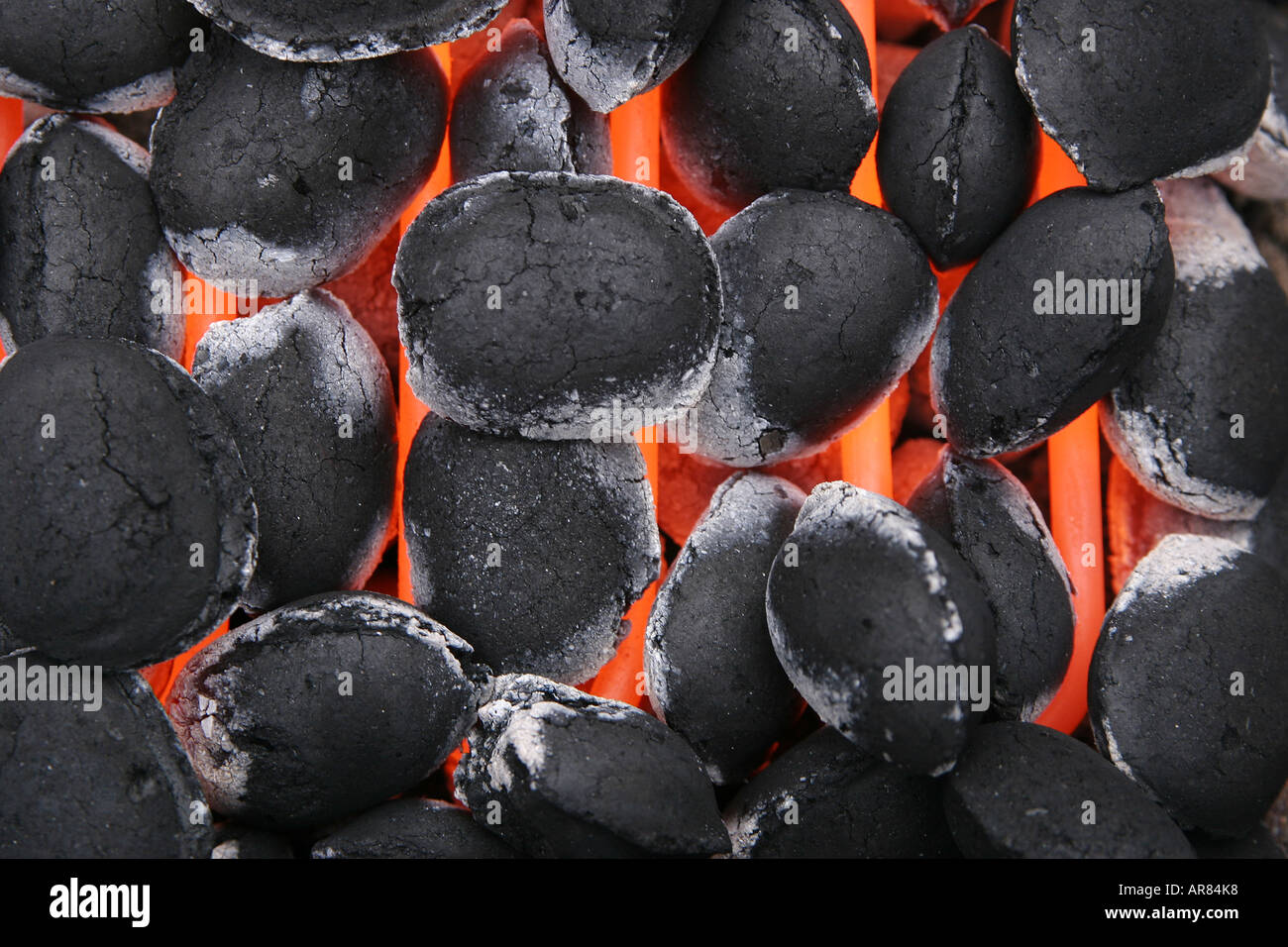 Lighting a charcoal grill with an electric heating tool Stock Photo - Alamy