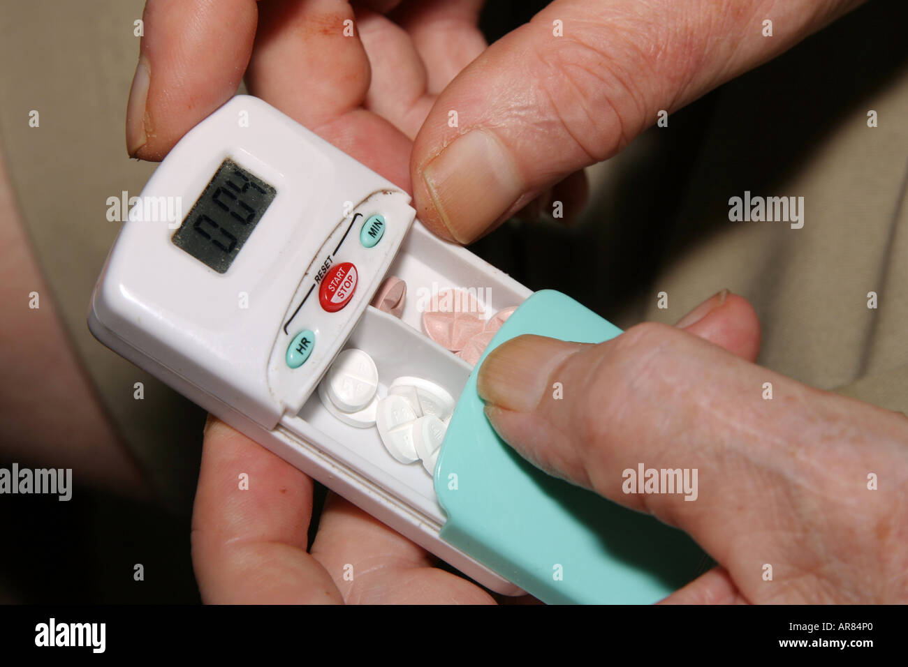 A medication timer with pills. You set the timer for a certain time ...