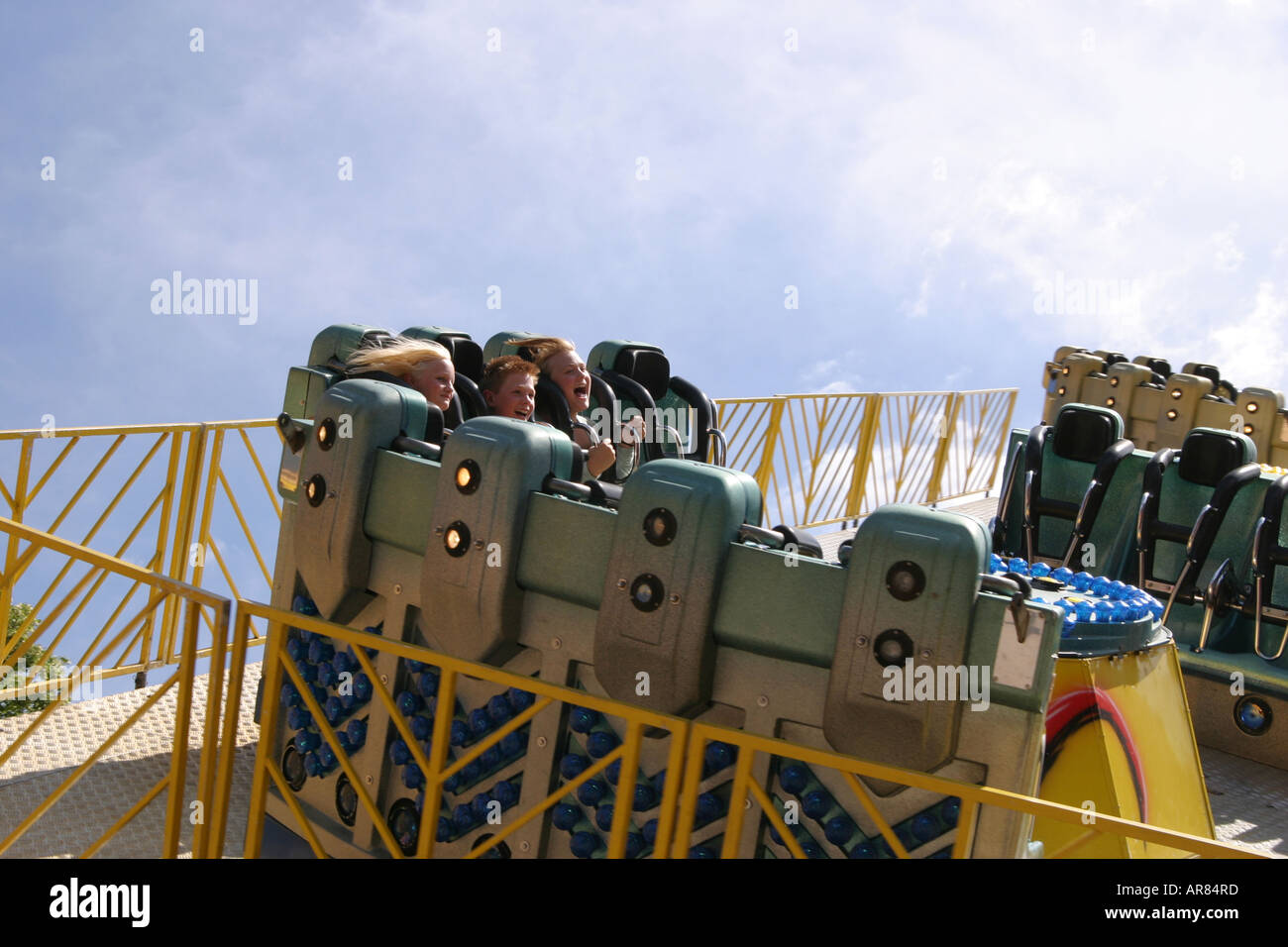 Tivoli ride in a fast spinning attraction Stock Photo - Alamy