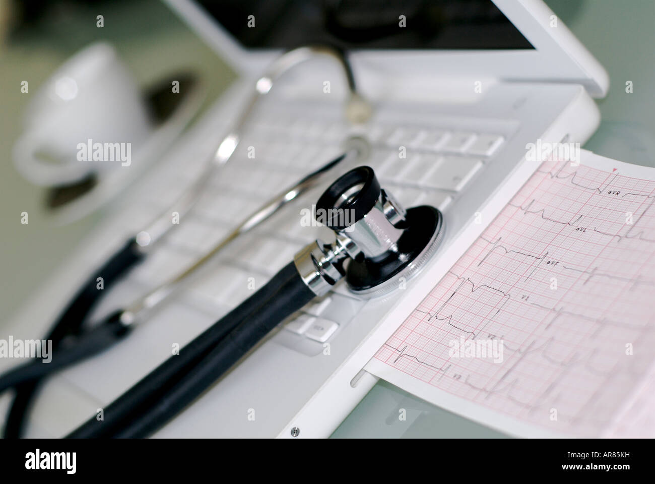 Modern EKG integrated with a notebook Stock Photo - Alamy