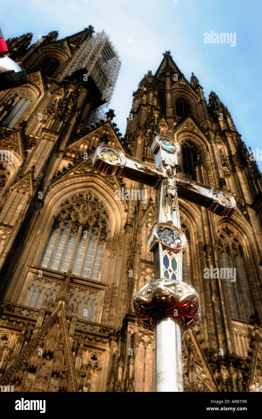 A symbolic cross being carried out of Cologne Cathedral after a service ...