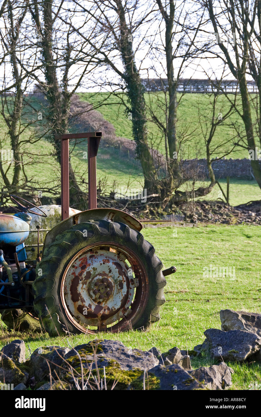 back of old tractor in rocky field Stock Photo - Alamy