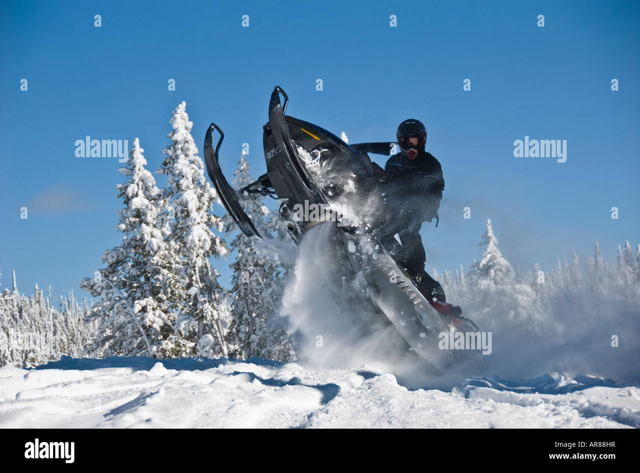 Rider catches air on his snowmobile, Two Top Loop Trail, West ...