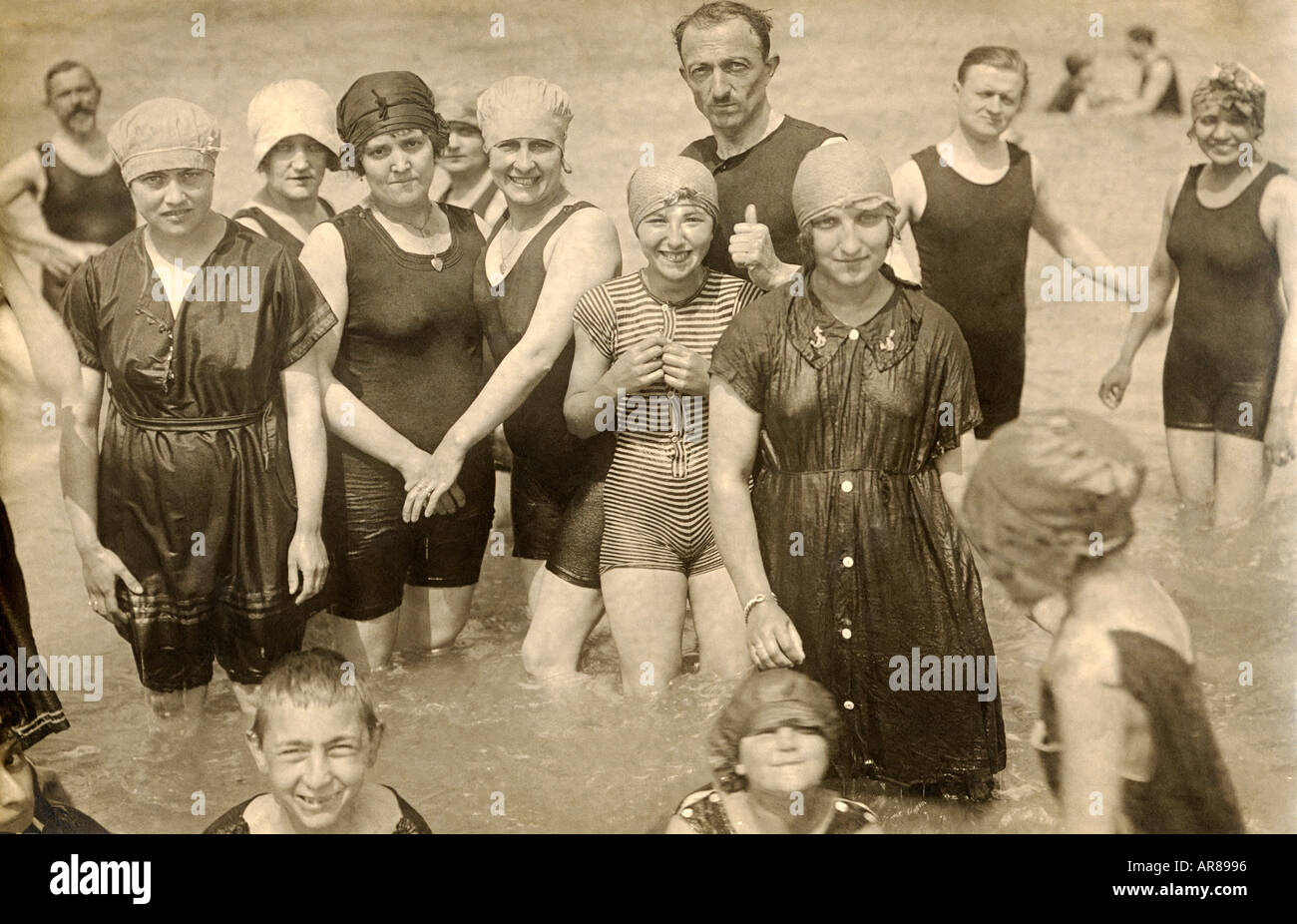 Vintage Image of Group Of People Wading in the Ocean at the Beach Stock ...