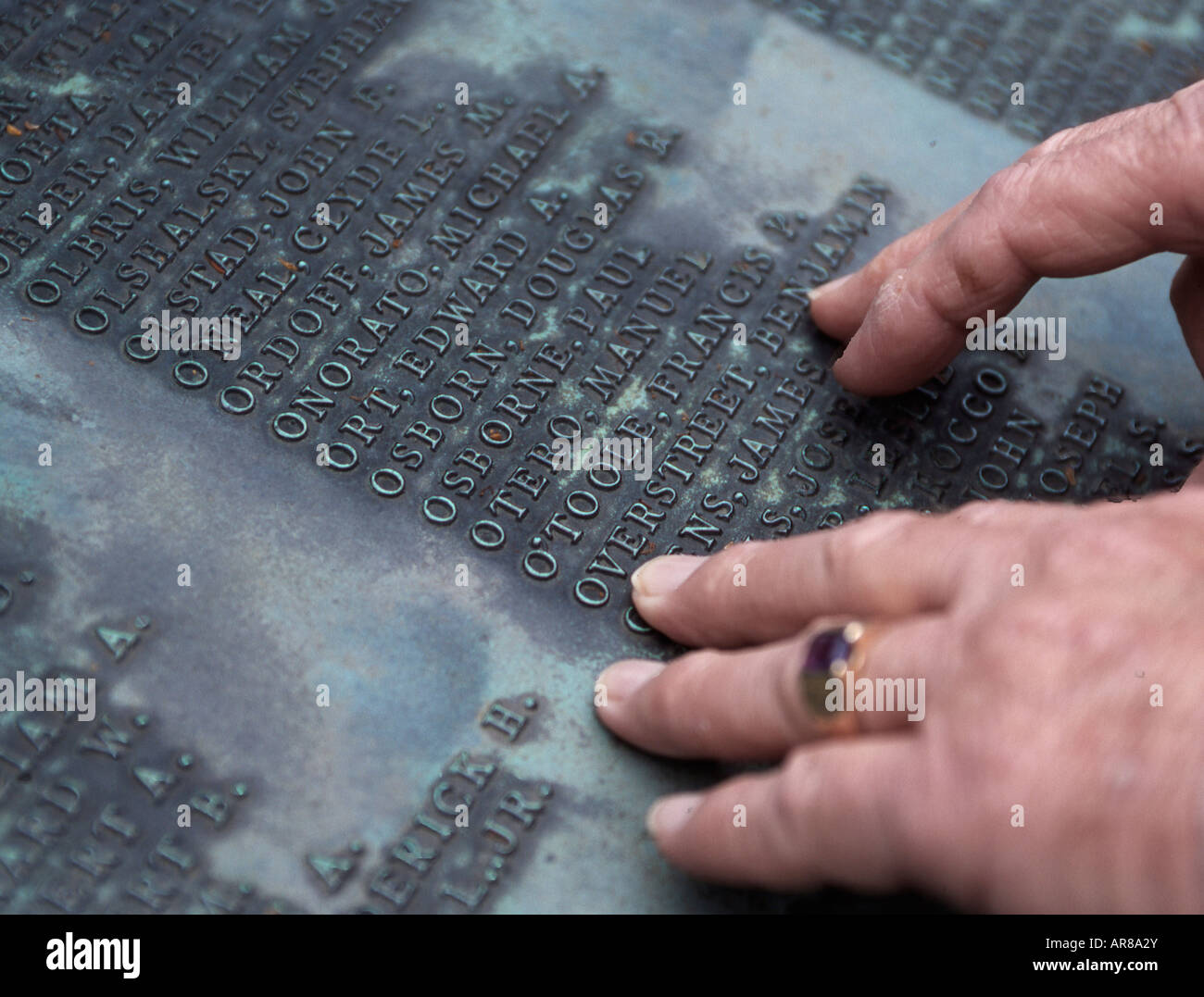 Hand pointing to a list of deceased veterans Stock Photo - Alamy