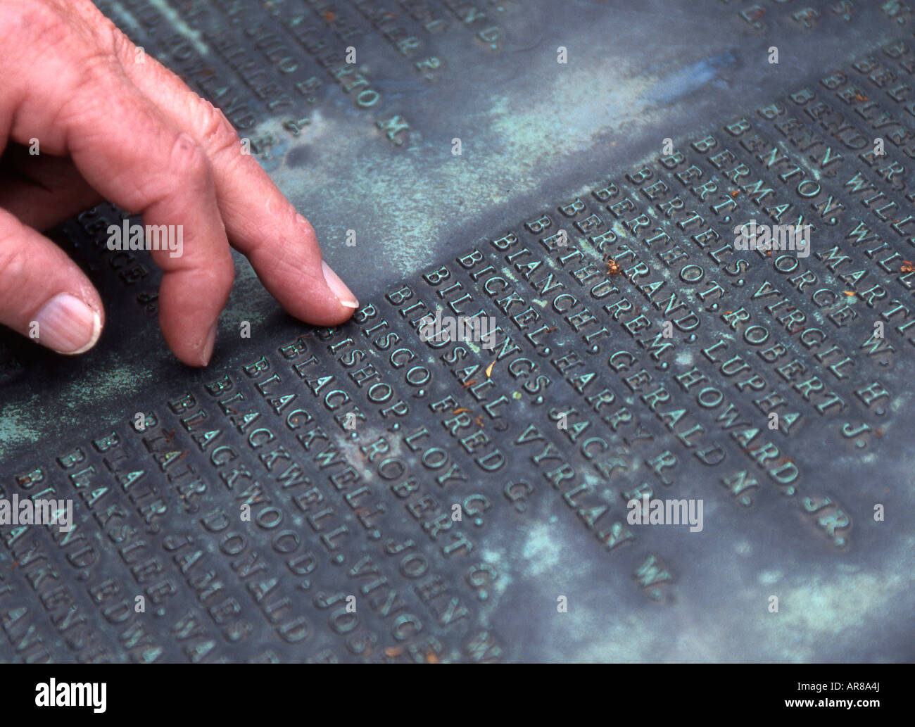 Hand pointing to a list of deceased veterans Stock Photo - Alamy