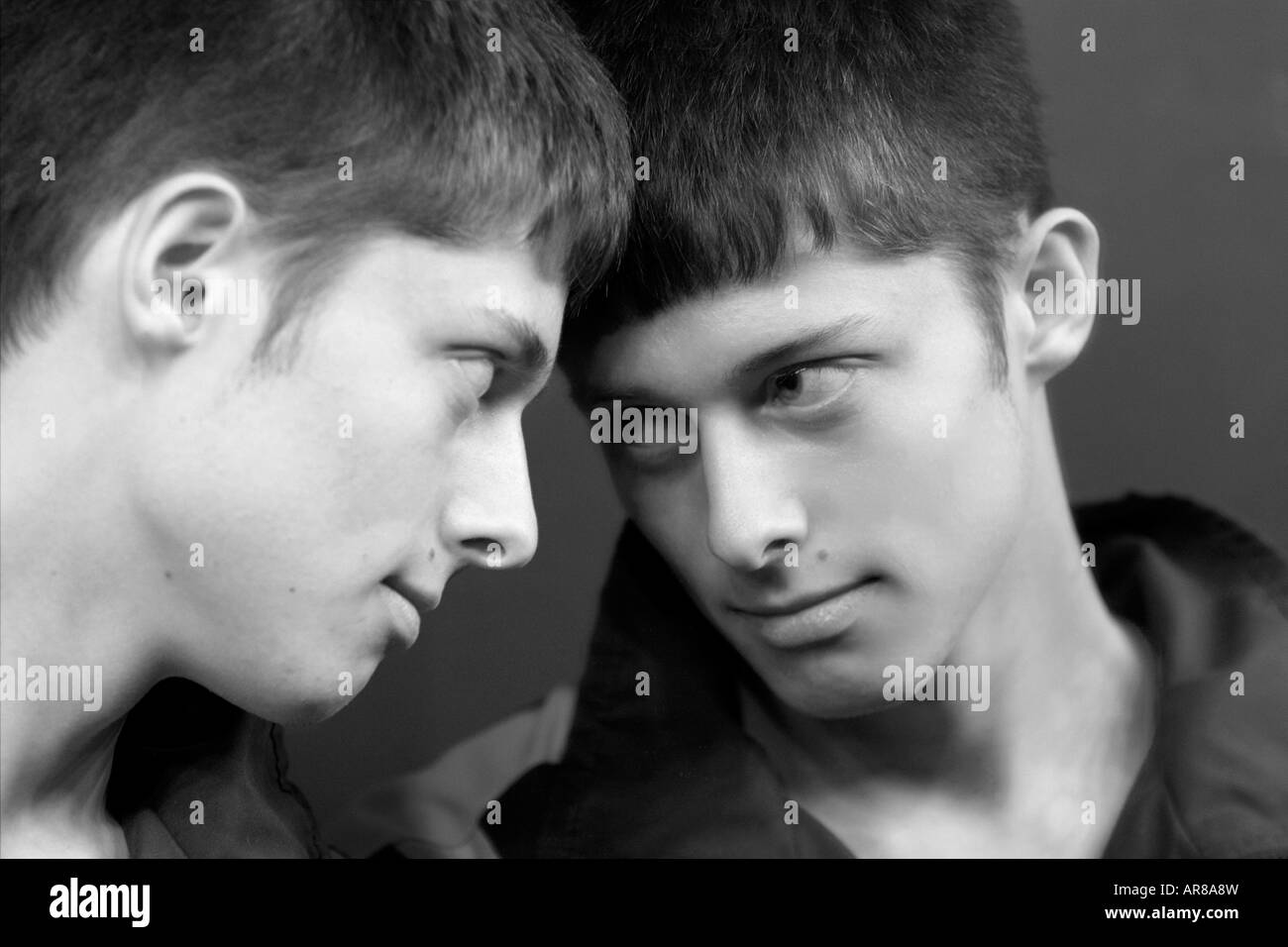 A young man close up on face reflecting in a mirror Stock Photo - Alamy