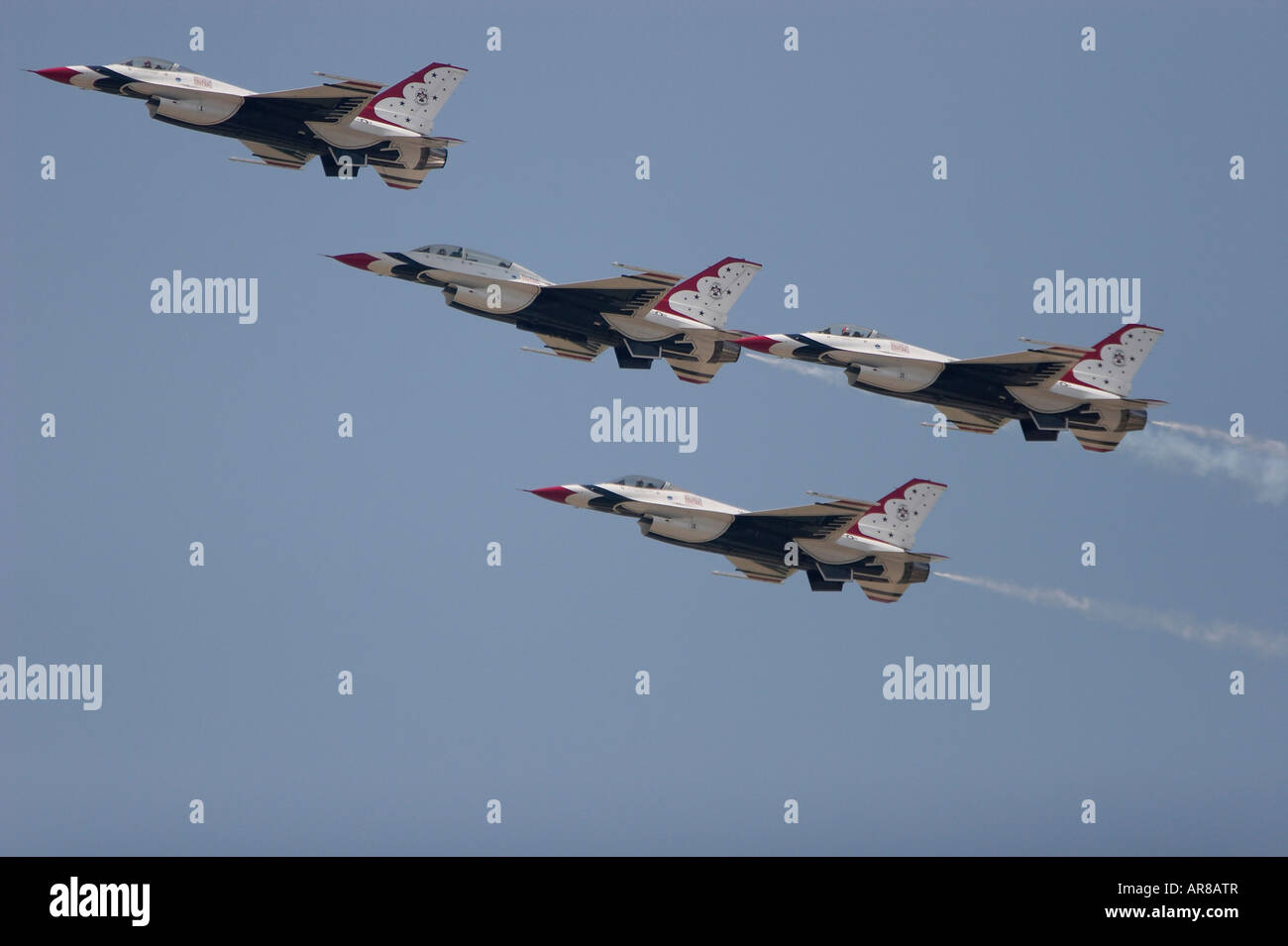 The USAF Thunderbirds F-16 aircraft flying in formation Stock Photo - Alamy
