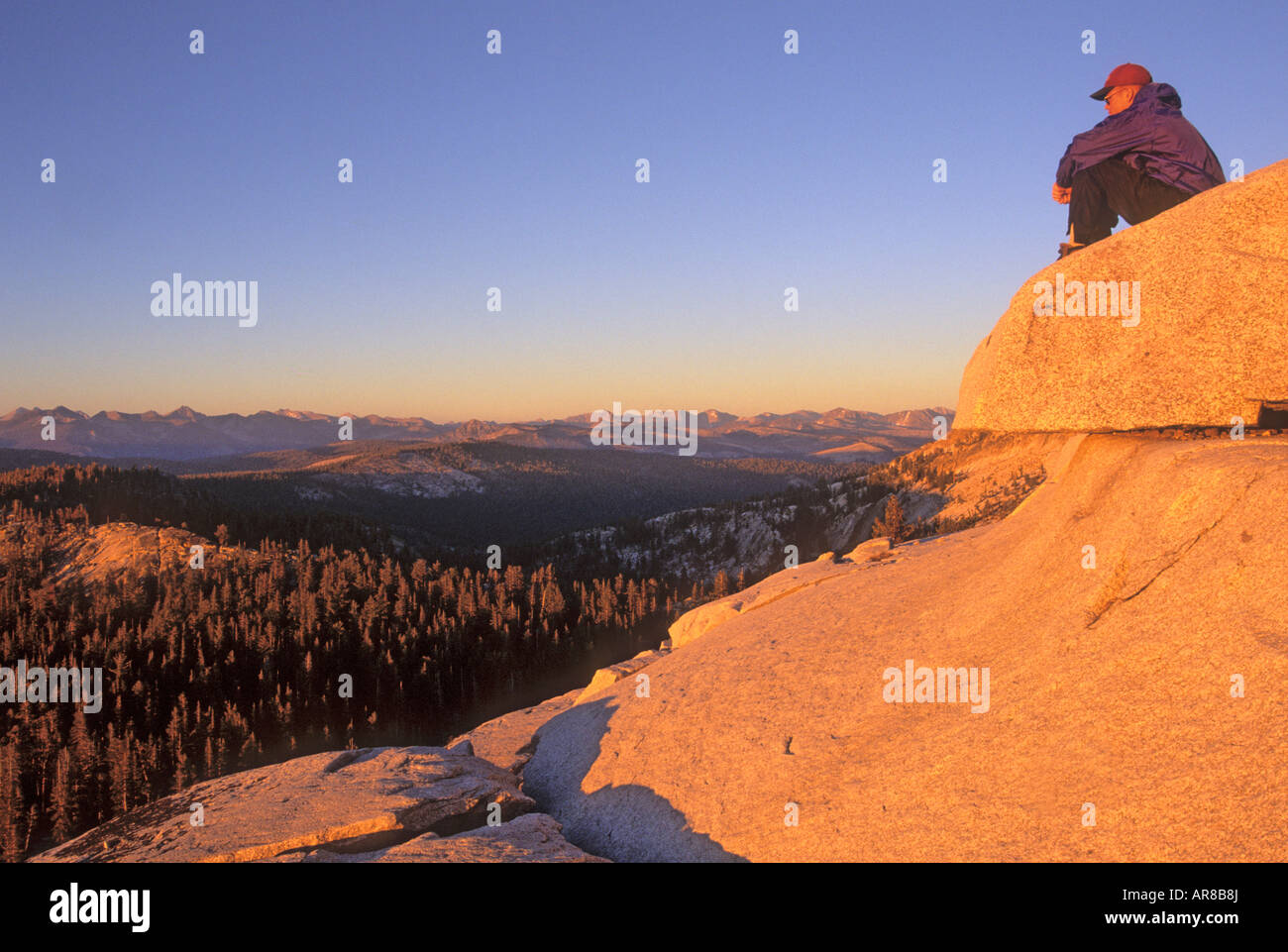 Hiker at sunset overlooking the Dinkey Lakes Wilderness, Sierra ...
