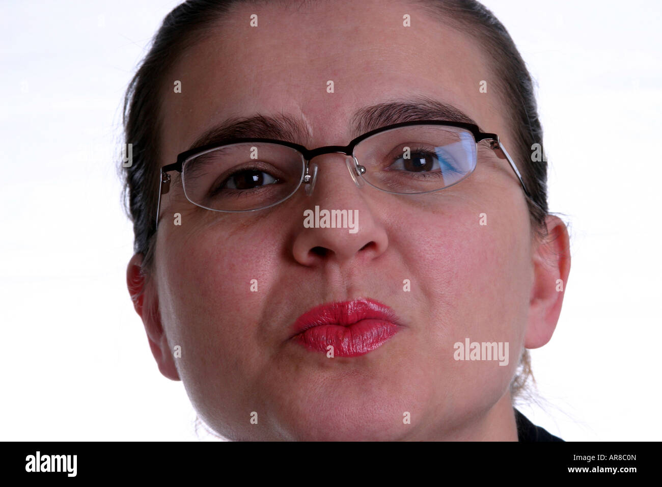 A beautiful woman puckering her lips to kiss Stock Photo - Alamy