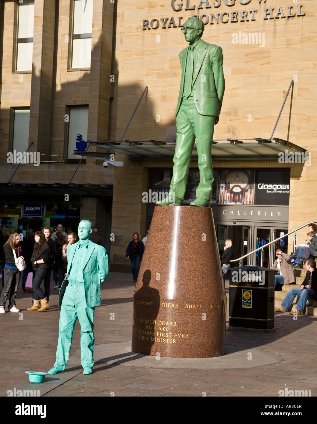 A mime artist in Buchanan Street Glasgow imitating the statue of Donald ...