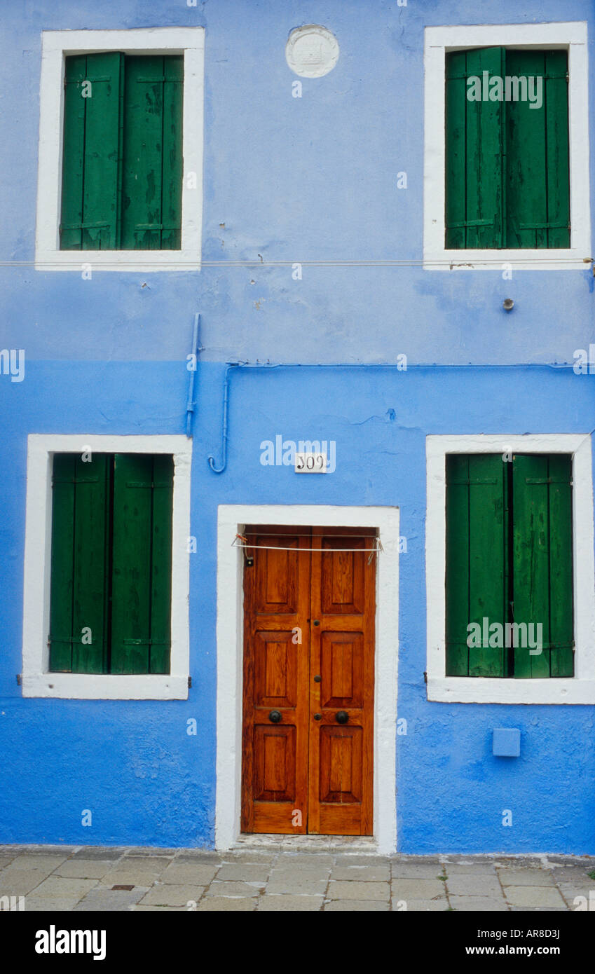 A blue house with green shutters is typical of the brightly painted ...