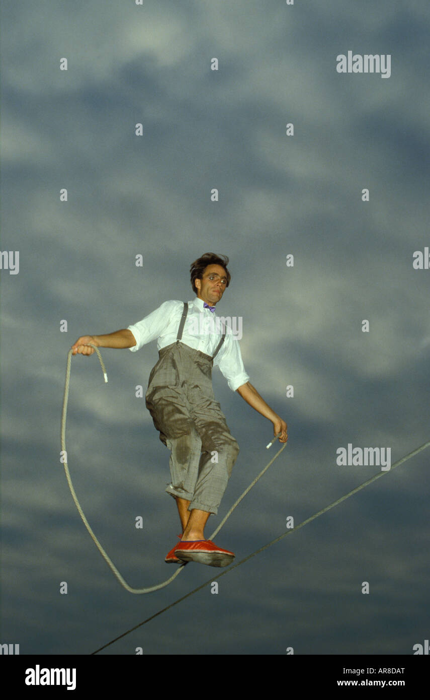 Rope dancer. Skipping. Man jumping with a rope on a rope Stock Photo ...