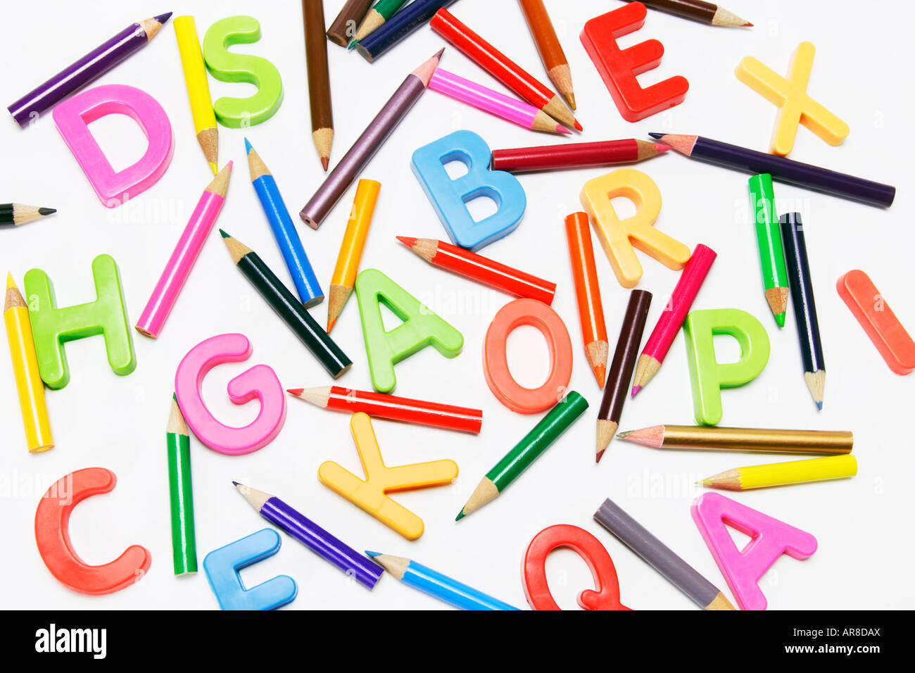 Colour Pencils and Plastic Alphabets Stock Photo - Alamy