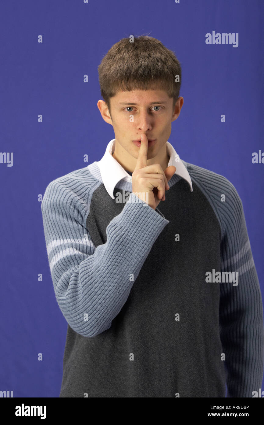 Man finger mouth saying quiet hi-res stock photography and images - Alamy