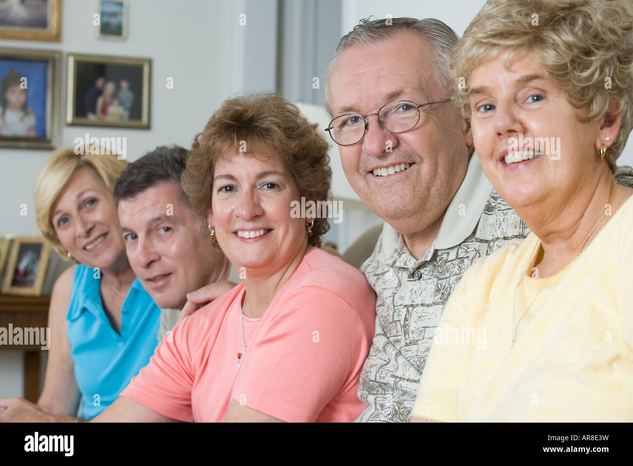 Group of people smiling together in a row Stock Photo - Alamy
