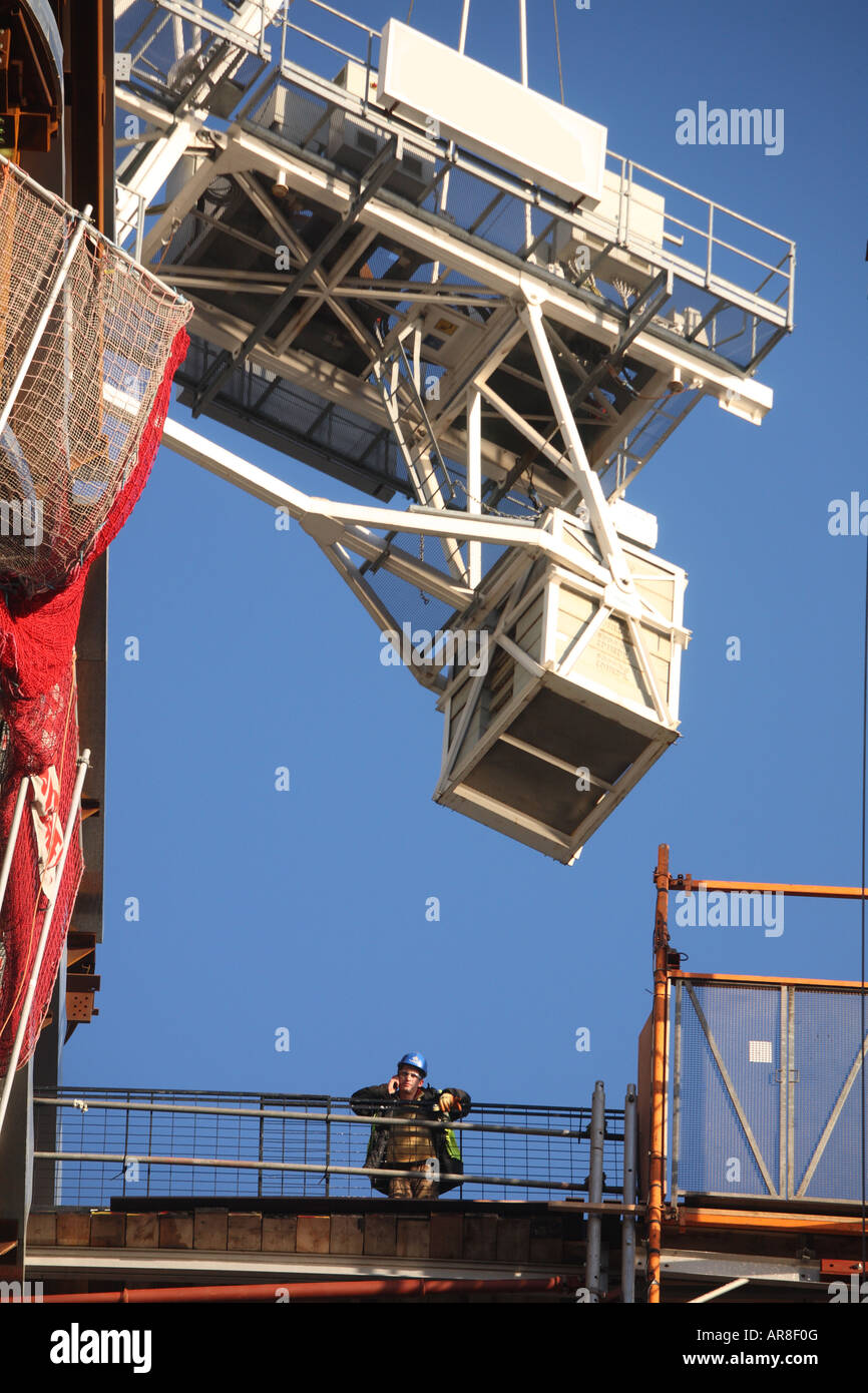 Construction worker high up on new development in Canary Wharf Stock ...