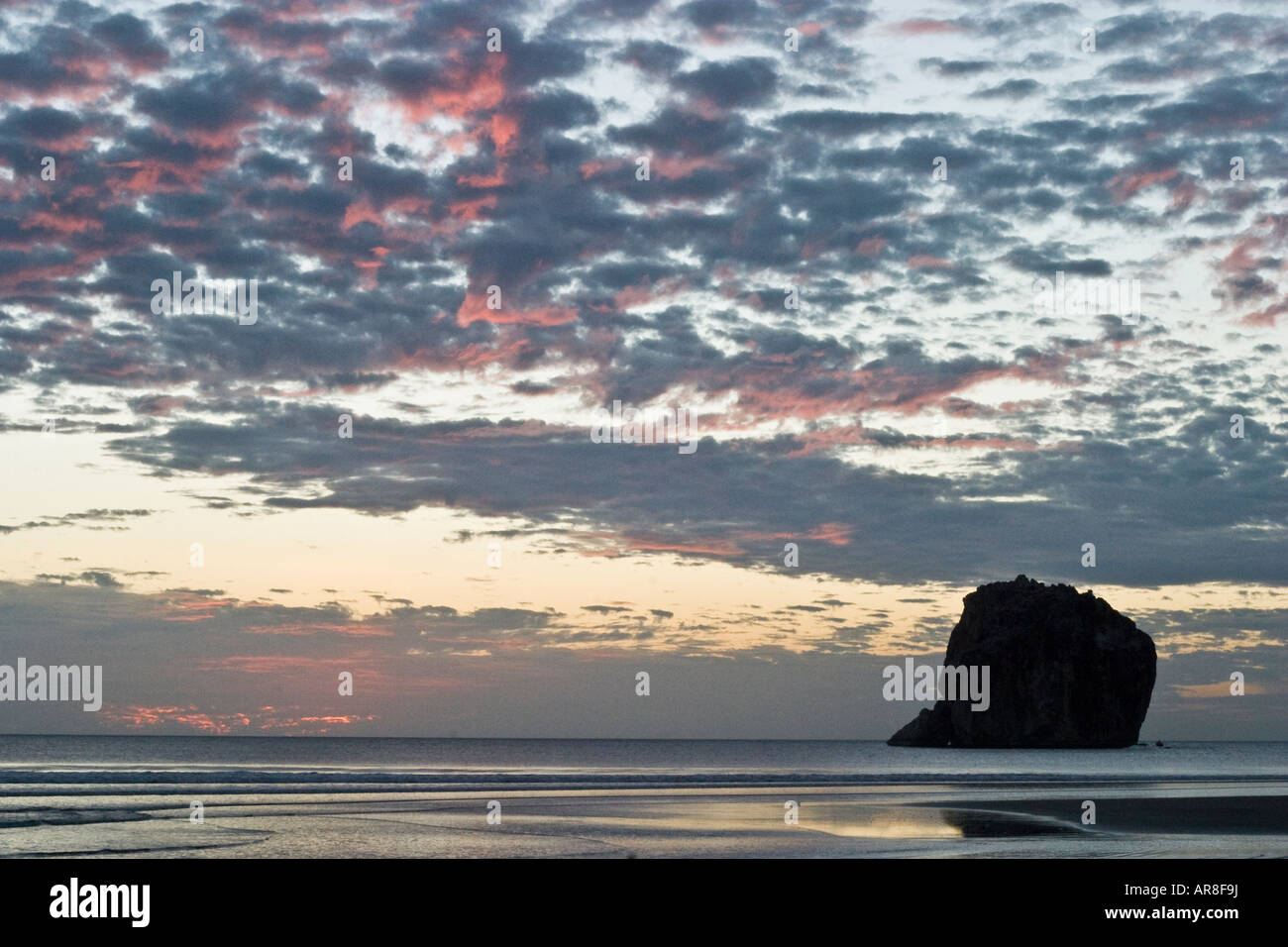 A silhouette of Witches rock at sunset in Santa Rosa National Park in ...