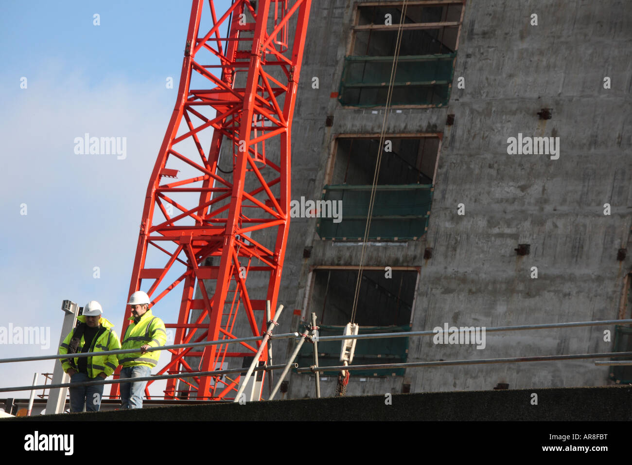 Construction workers on building site Stock Photo - Alamy
