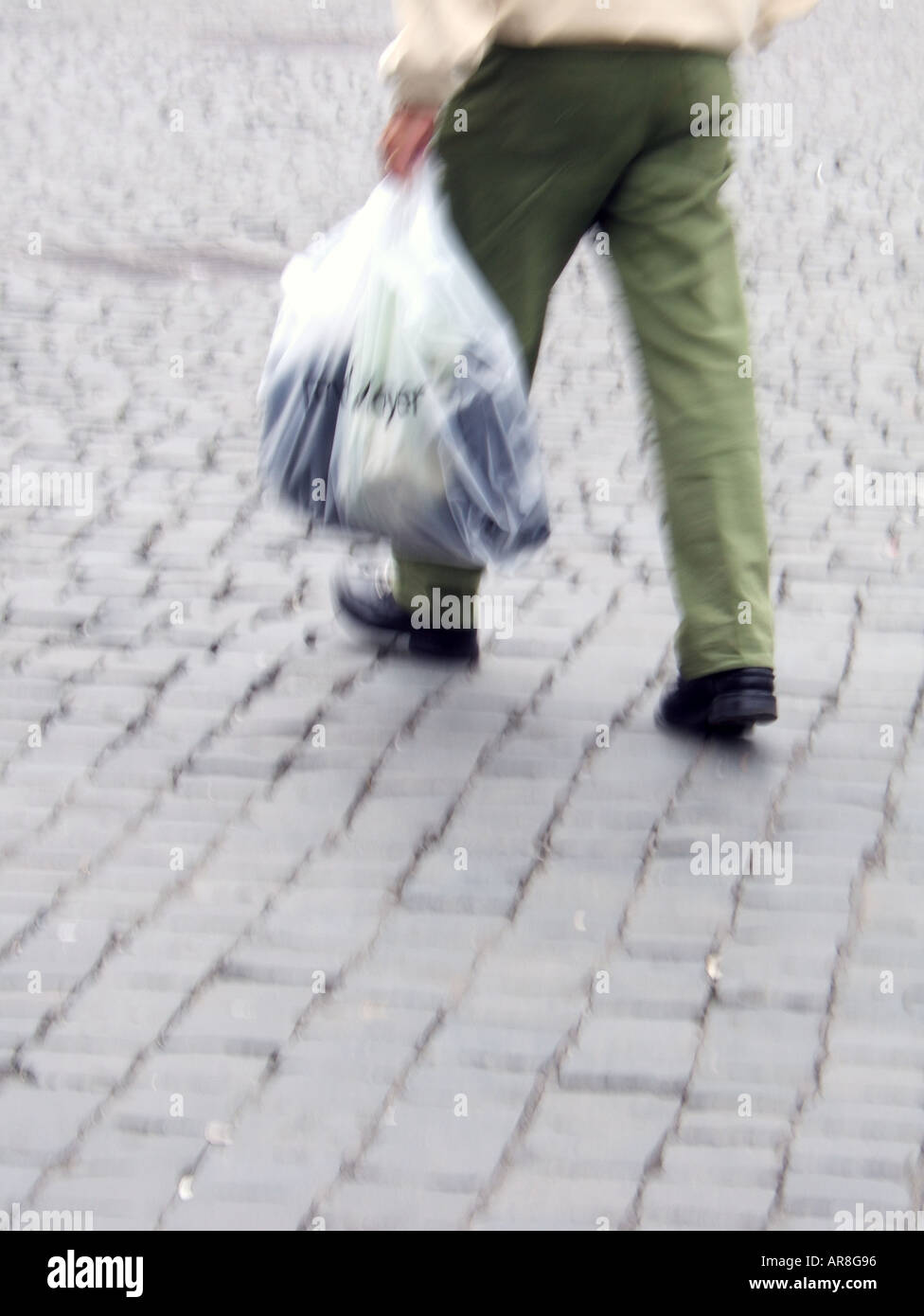 Man carrying plastic bag running hi-res stock photography and images ...