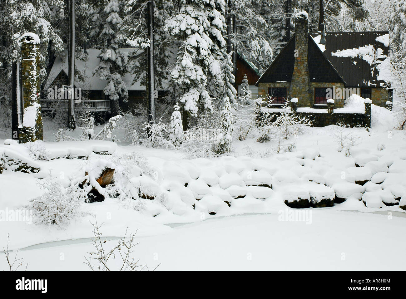 Cabins made of stone buried in fresh winter snow Stock Photo - Alamy
