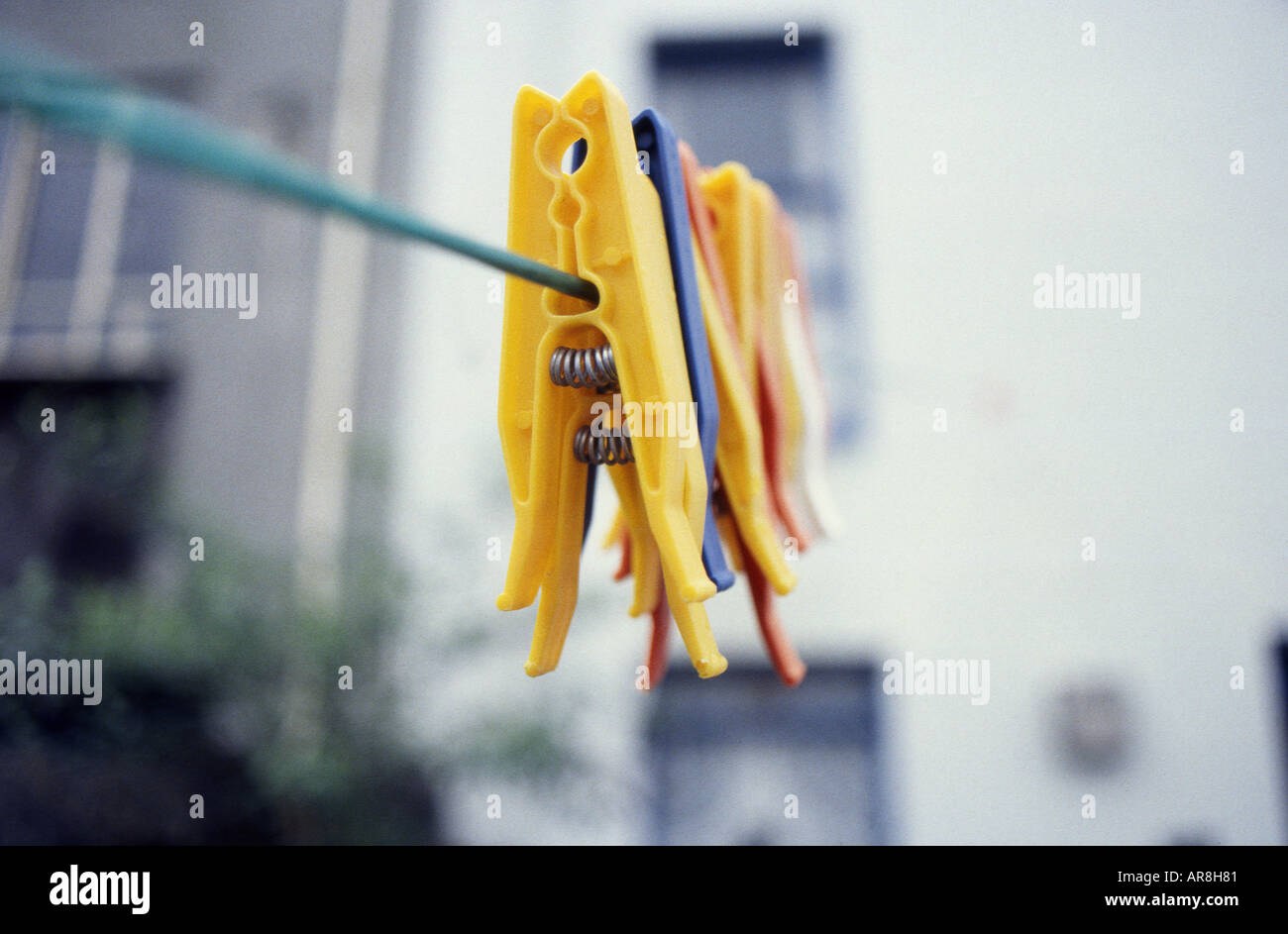 coloured pegs on a washing line Stock Photo - Alamy