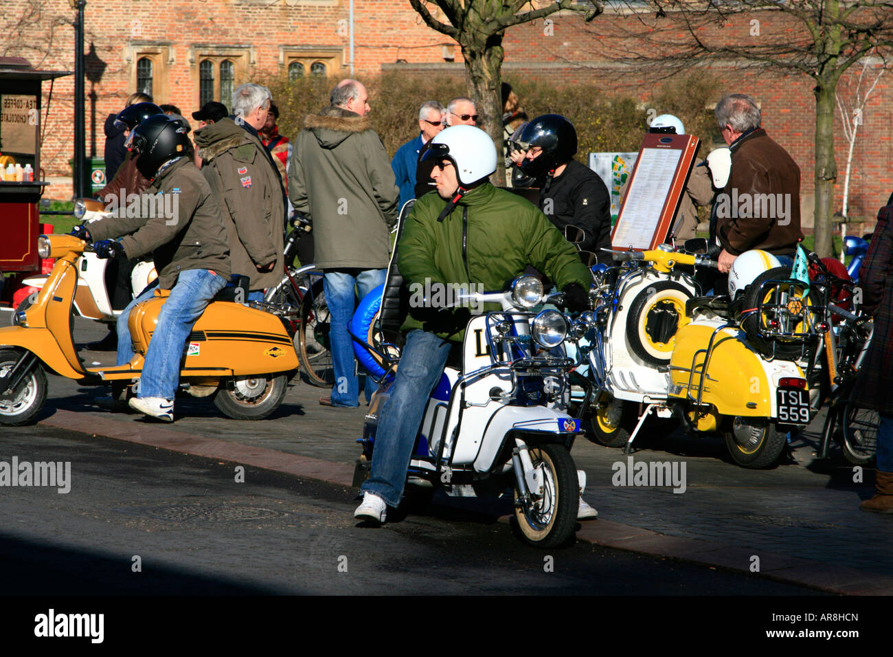 group of motor scooter riders city of cambridge town centre ...