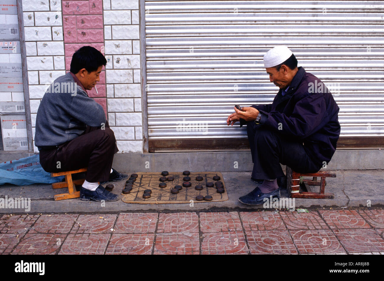 Chinese men playing Xiangqi also called Chinese chess which is a ...